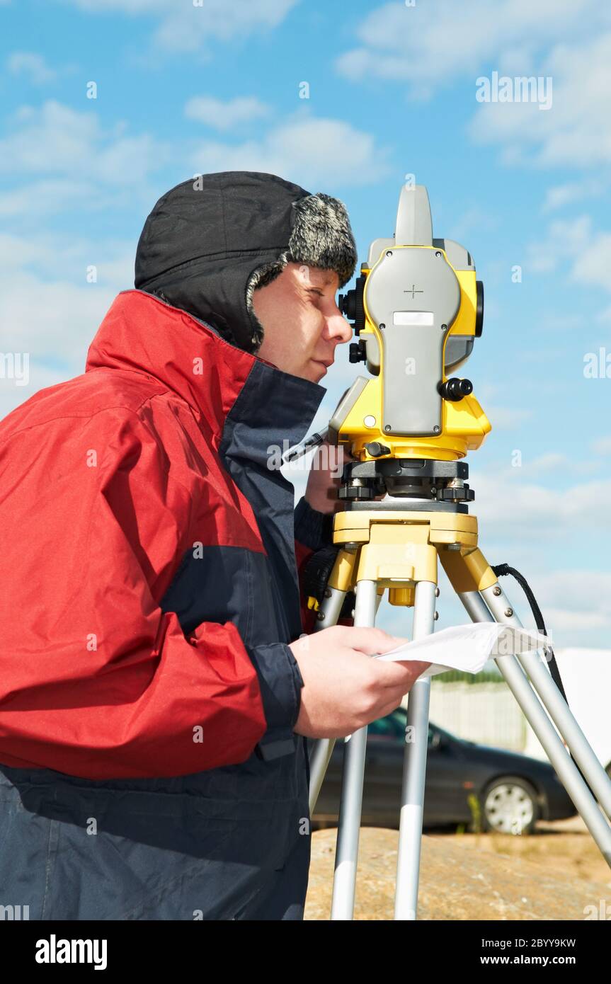 surveyor works with theodolite tacheometer Stock Photo - Alamy
