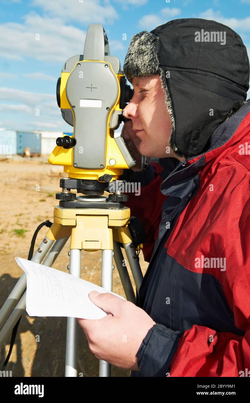 surveyor works with theodolite tacheometer Stock Photo - Alamy
