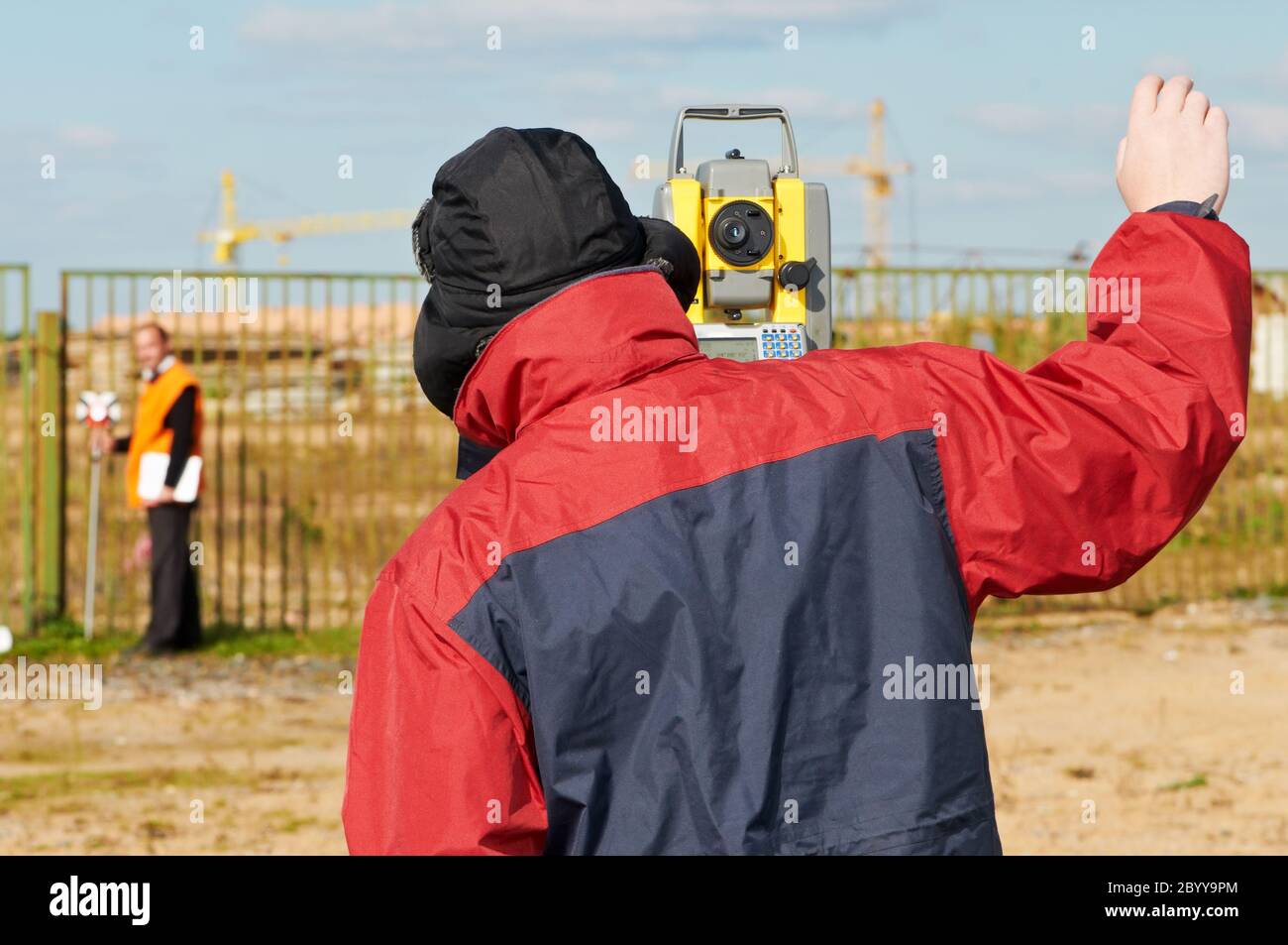 surveyor works with theodolite tacheometer Stock Photo - Alamy