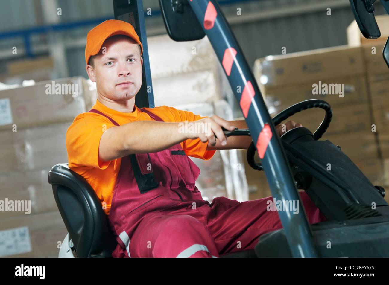 warehouse forklift loader worker Stock Photo - Alamy
