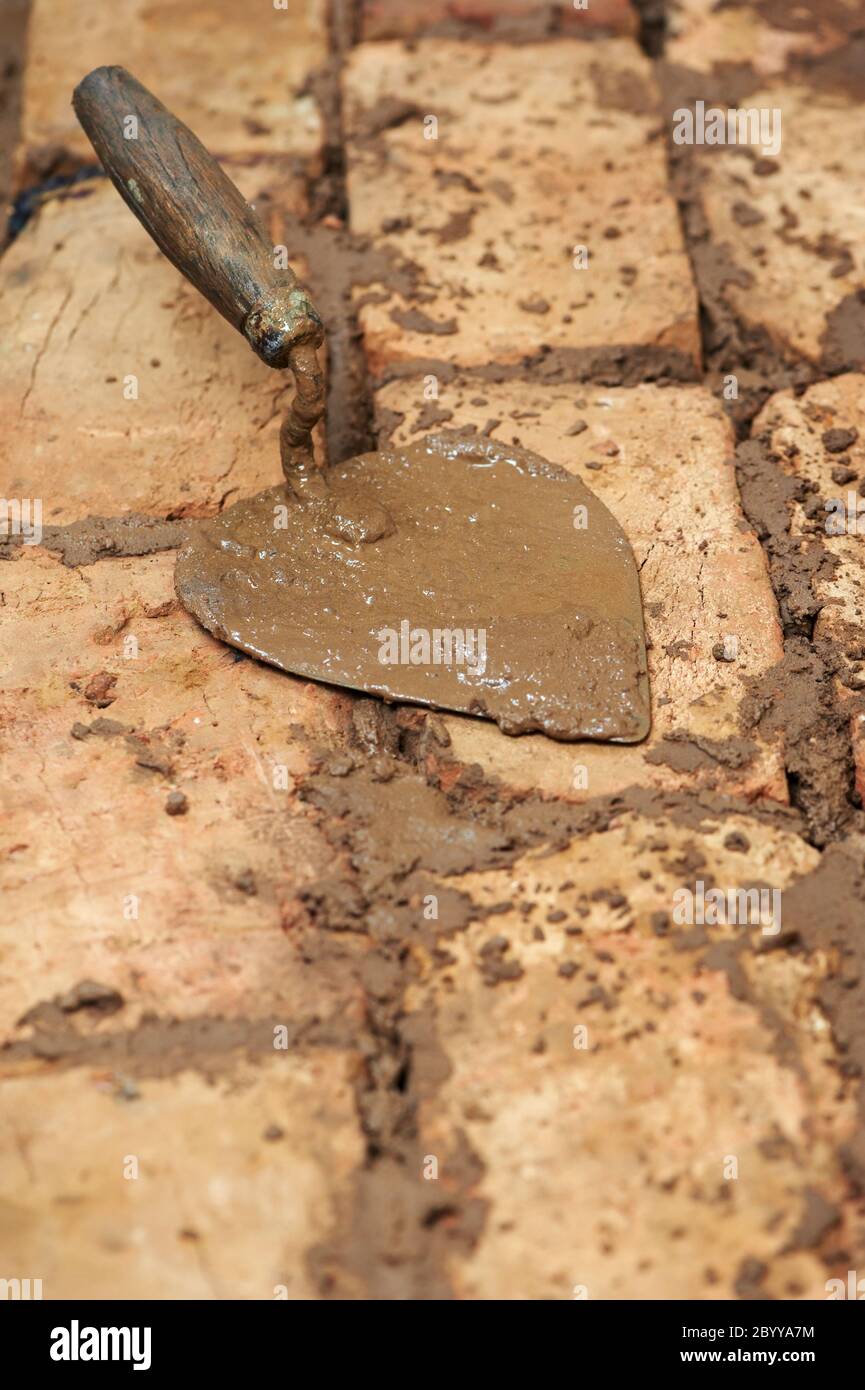 Mason bricklaying background Stock Photo - Alamy