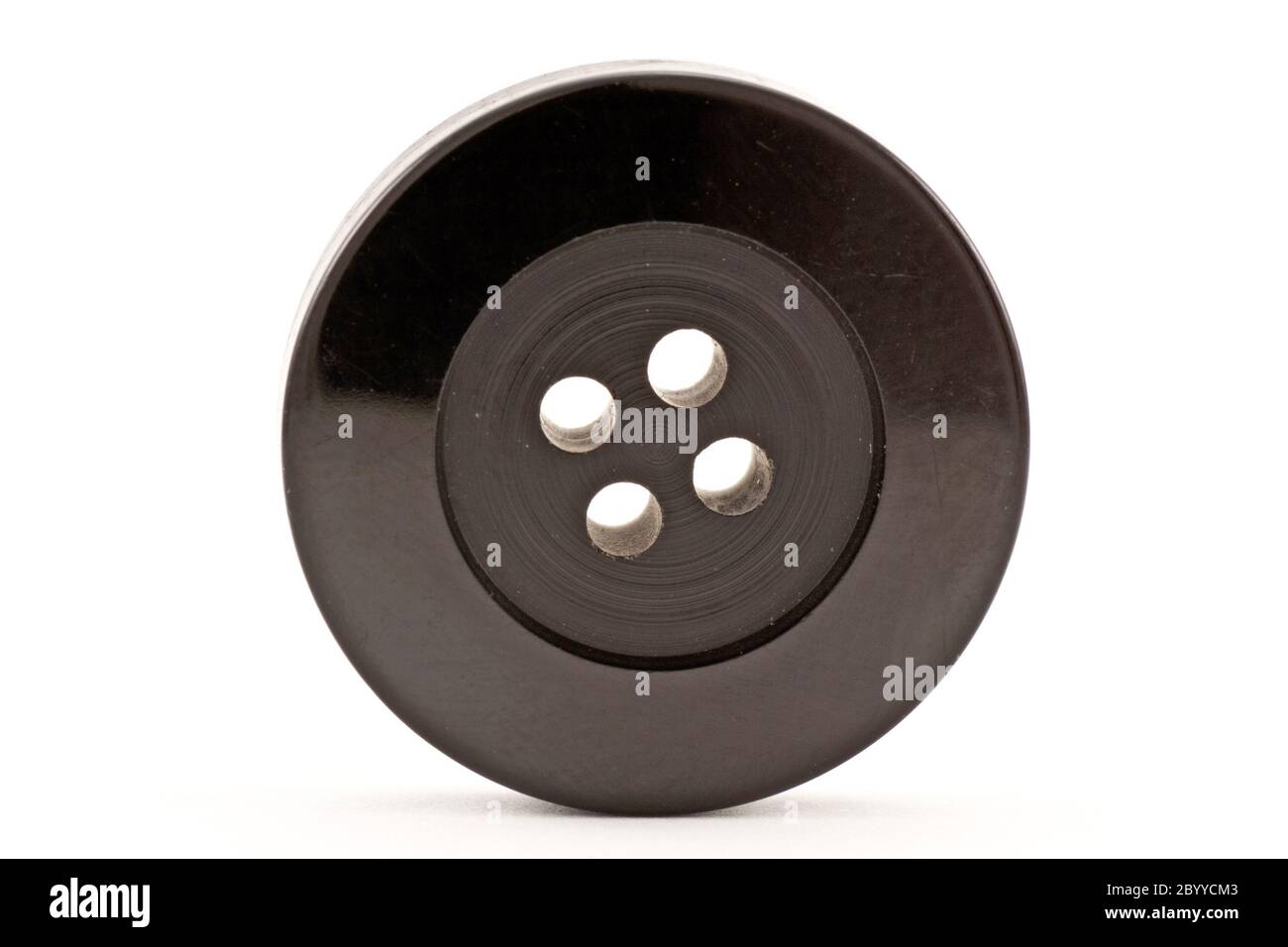 black clothes button Stock Photo - Alamy