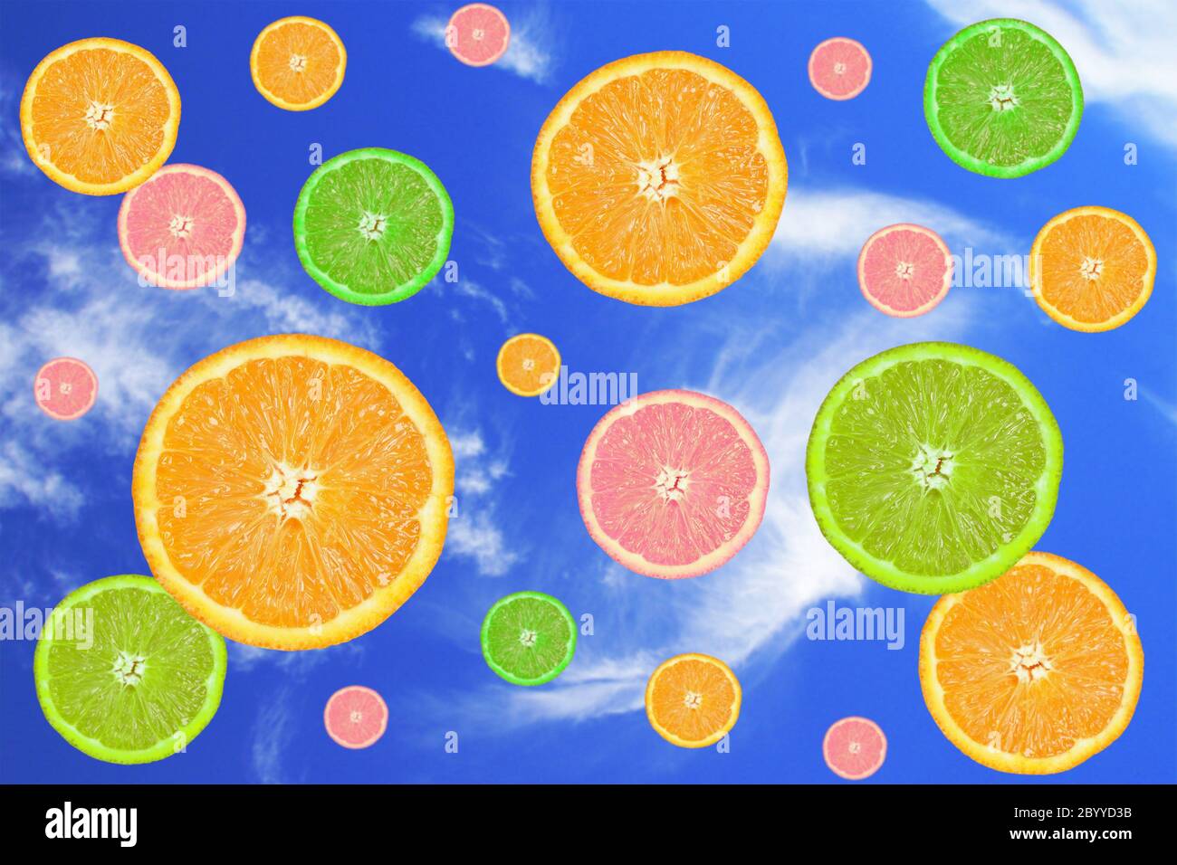 citrus fruits slices falling in a sky Stock Photo - Alamy