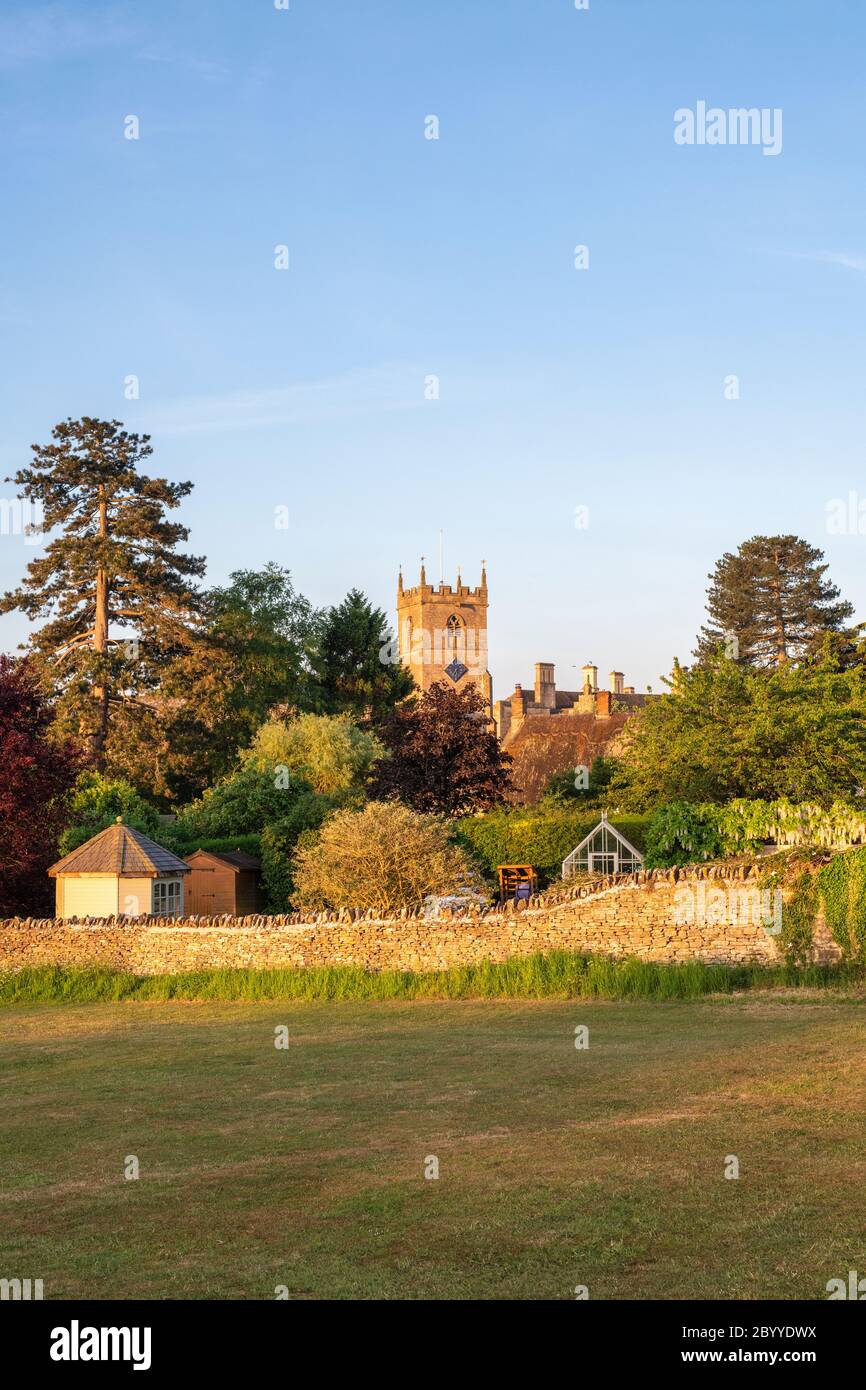 Combe village with St Laurence church tower in the early morning at ...