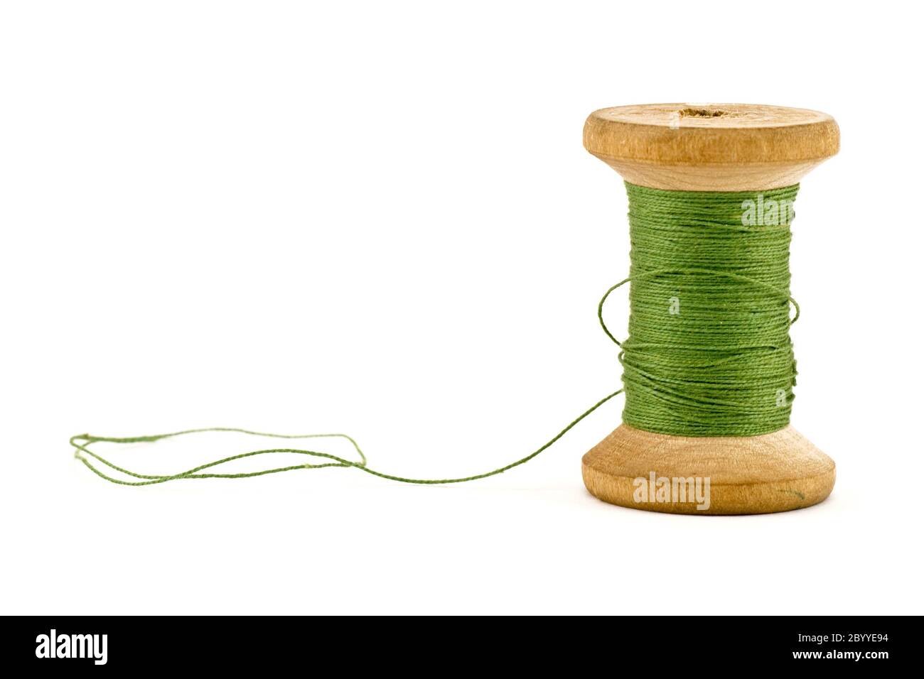 green thread spool Stock Photo - Alamy
