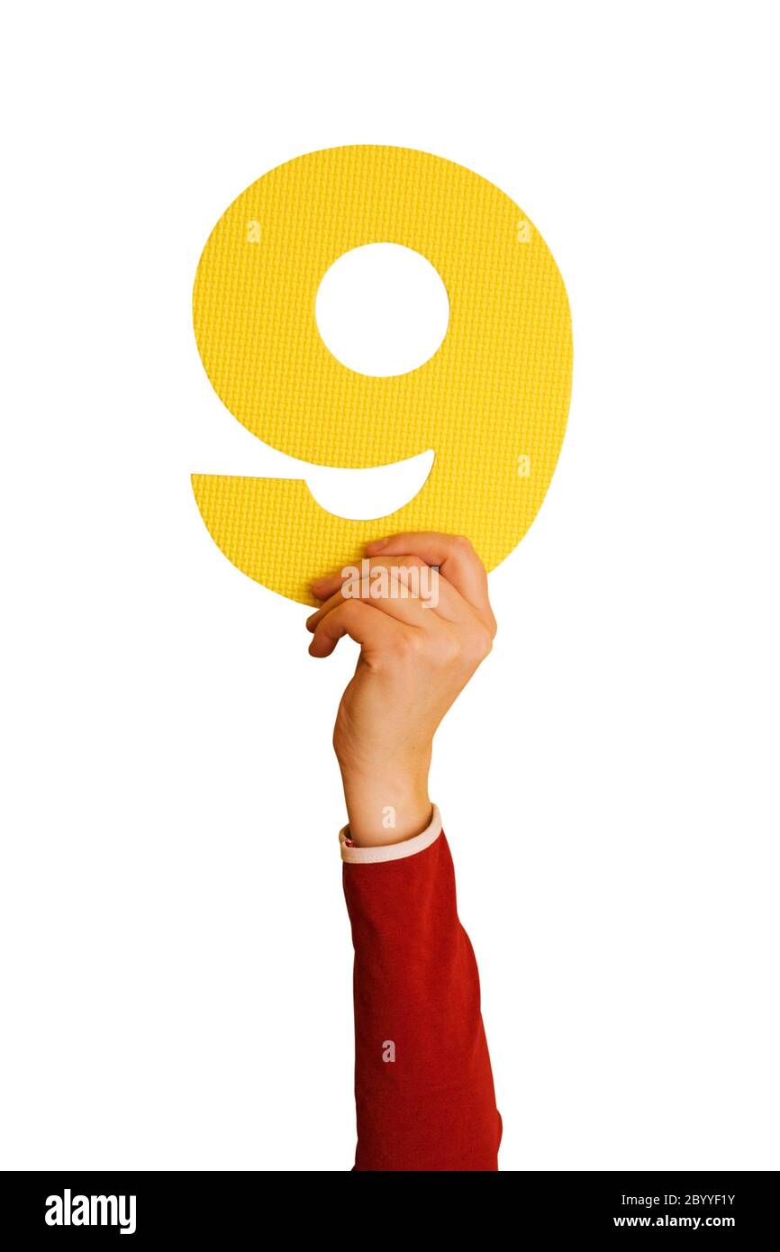 number nine in hand Stock Photo - Alamy