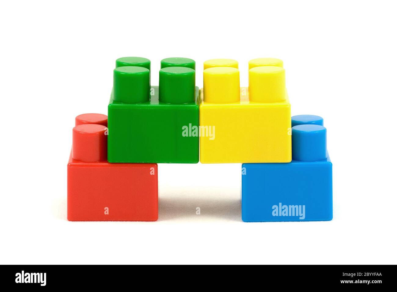 four colorful plastic toy bricks Stock Photo - Alamy