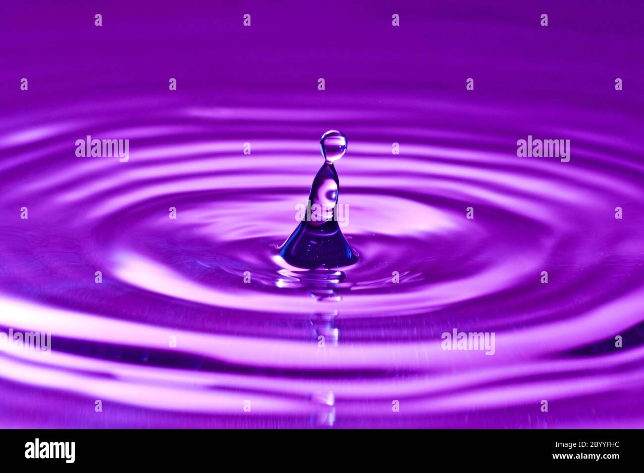 purple droplet splash Stock Photo - Alamy