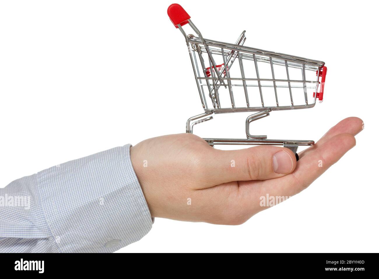 Hand holding shopping cart Stock Photo - Alamy