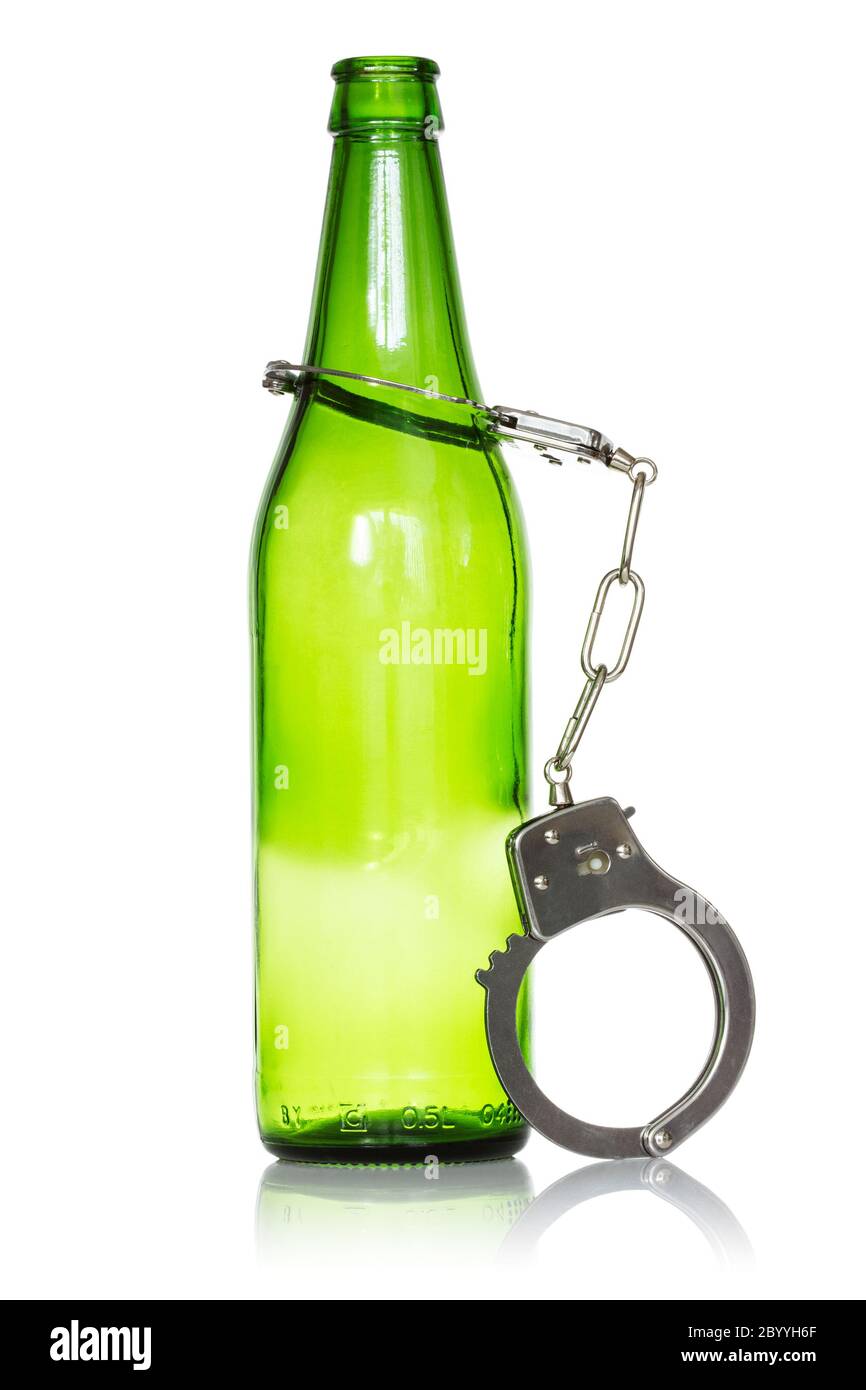 Bottle and handcuffs Stock Photo - Alamy