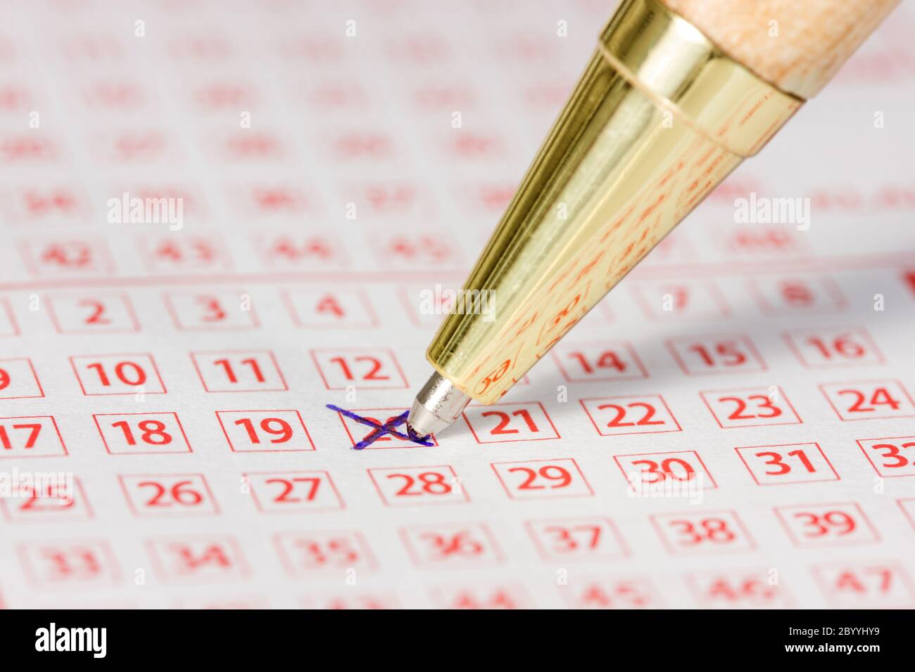 Lottery ticket with a marked number and a pen Stock Photo - Alamy