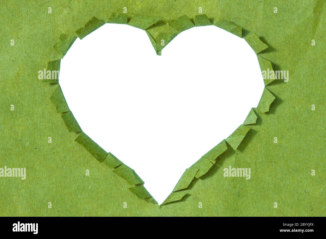 Ripped heart in a green paper Stock Photo - Alamy