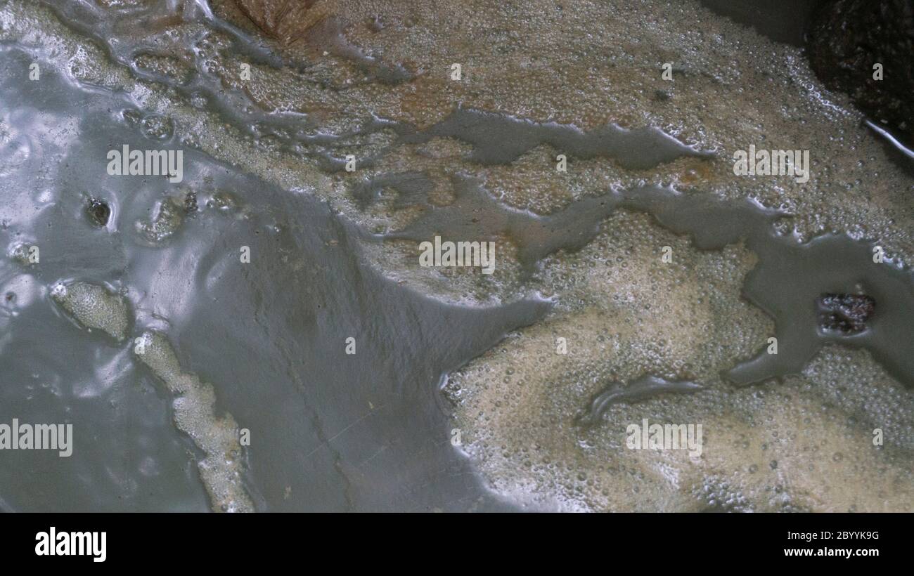 Scum bubbles floating on a surface of polluted water Stock Photo - Alamy