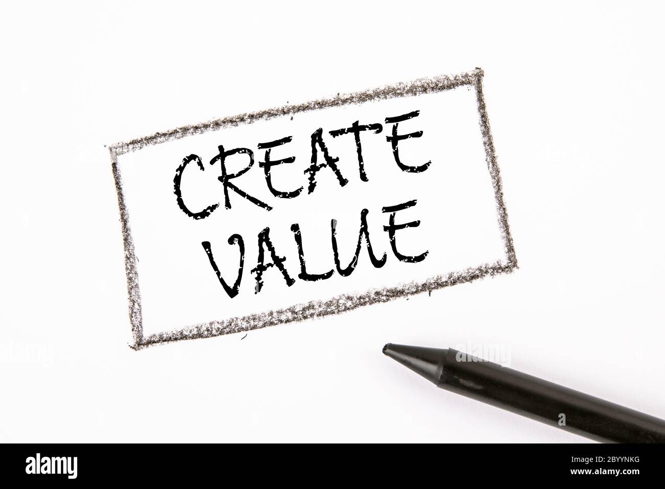 CREATE VALUE concept. Text on a white page. Black pastels Stock Photo ...