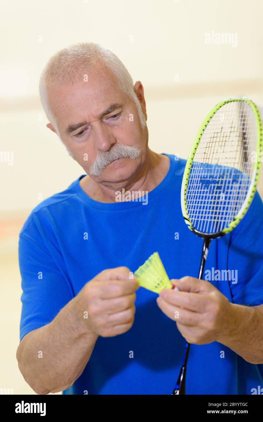 senior man with badminton racket in the nature in summer Stock Photo ...