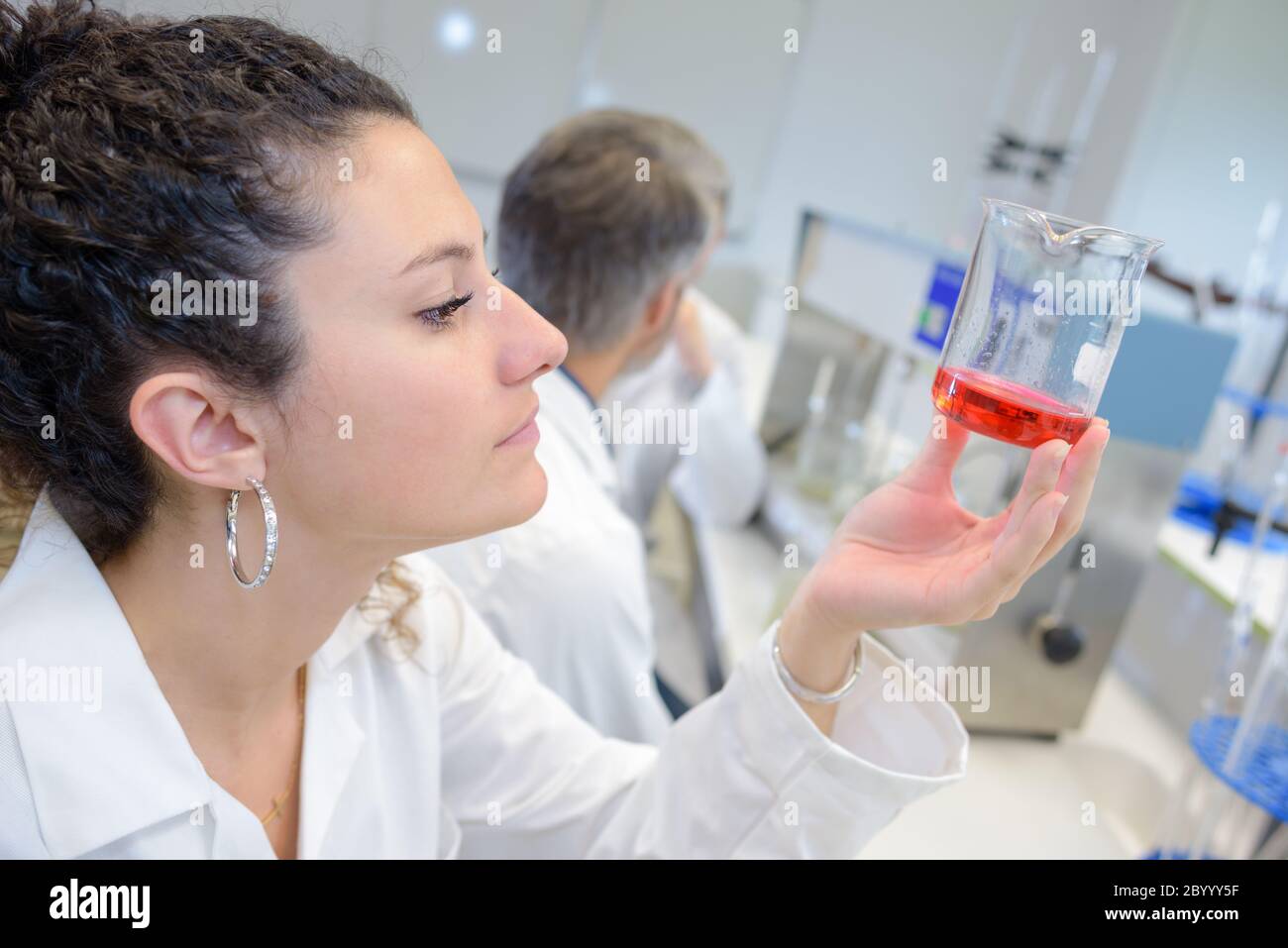 female scientists with glass beaker Stock Photo - Alamy