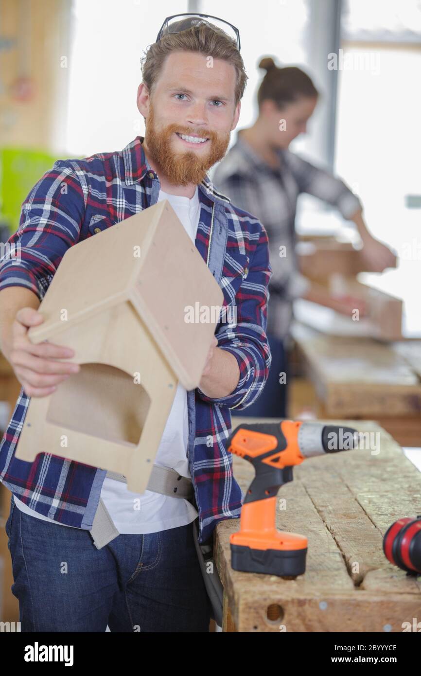 hand building house with wooden blocks Stock Photo - Alamy