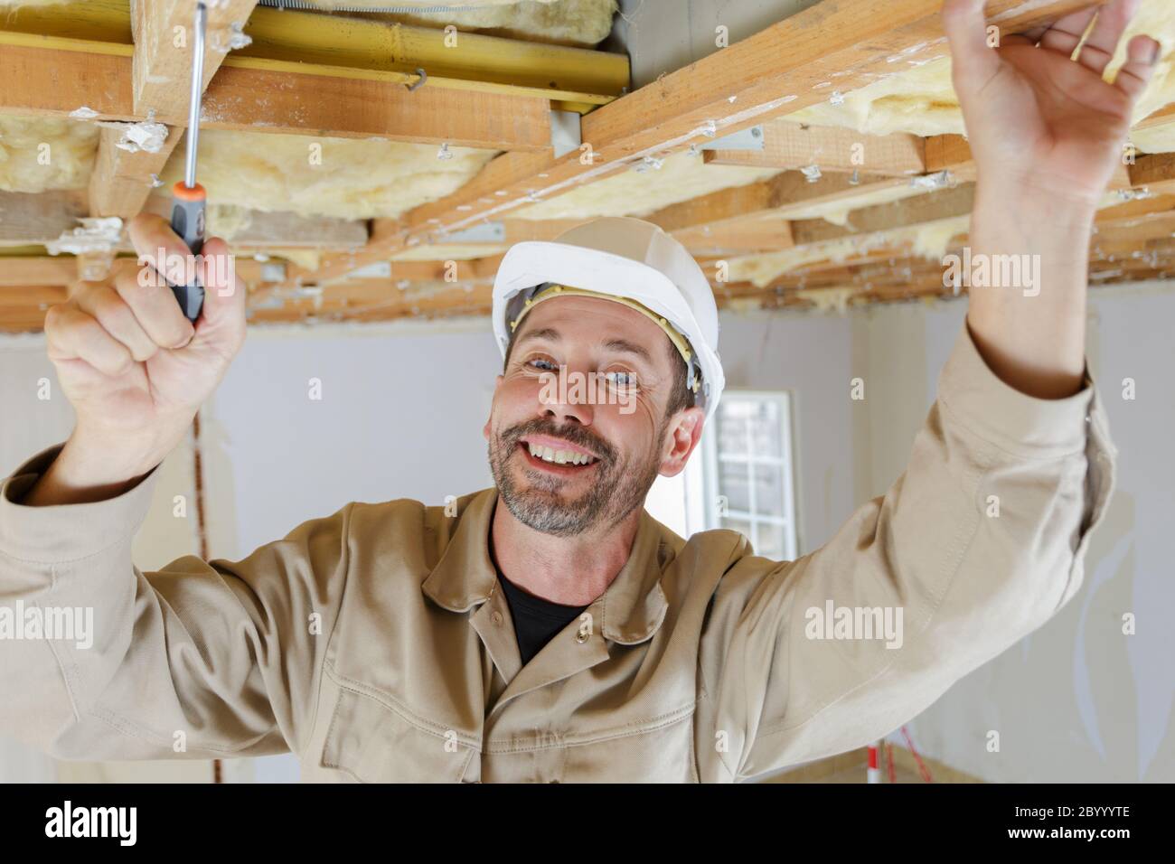 Plasterer spreading plaster ceiling hi-res stock photography and images ...