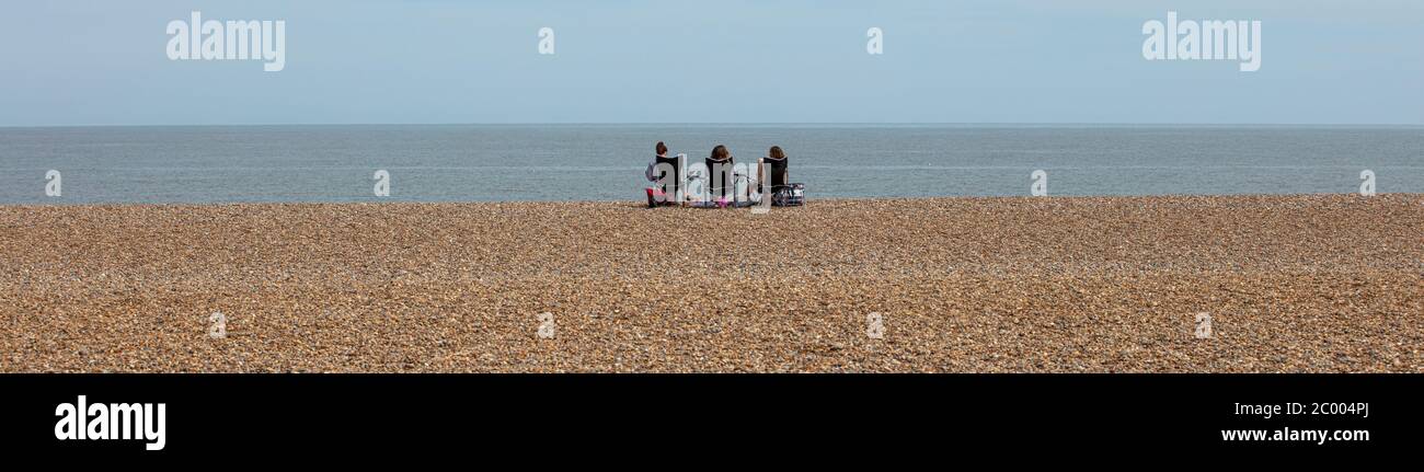 Reading quietly by the sea Stock Photo - Alamy