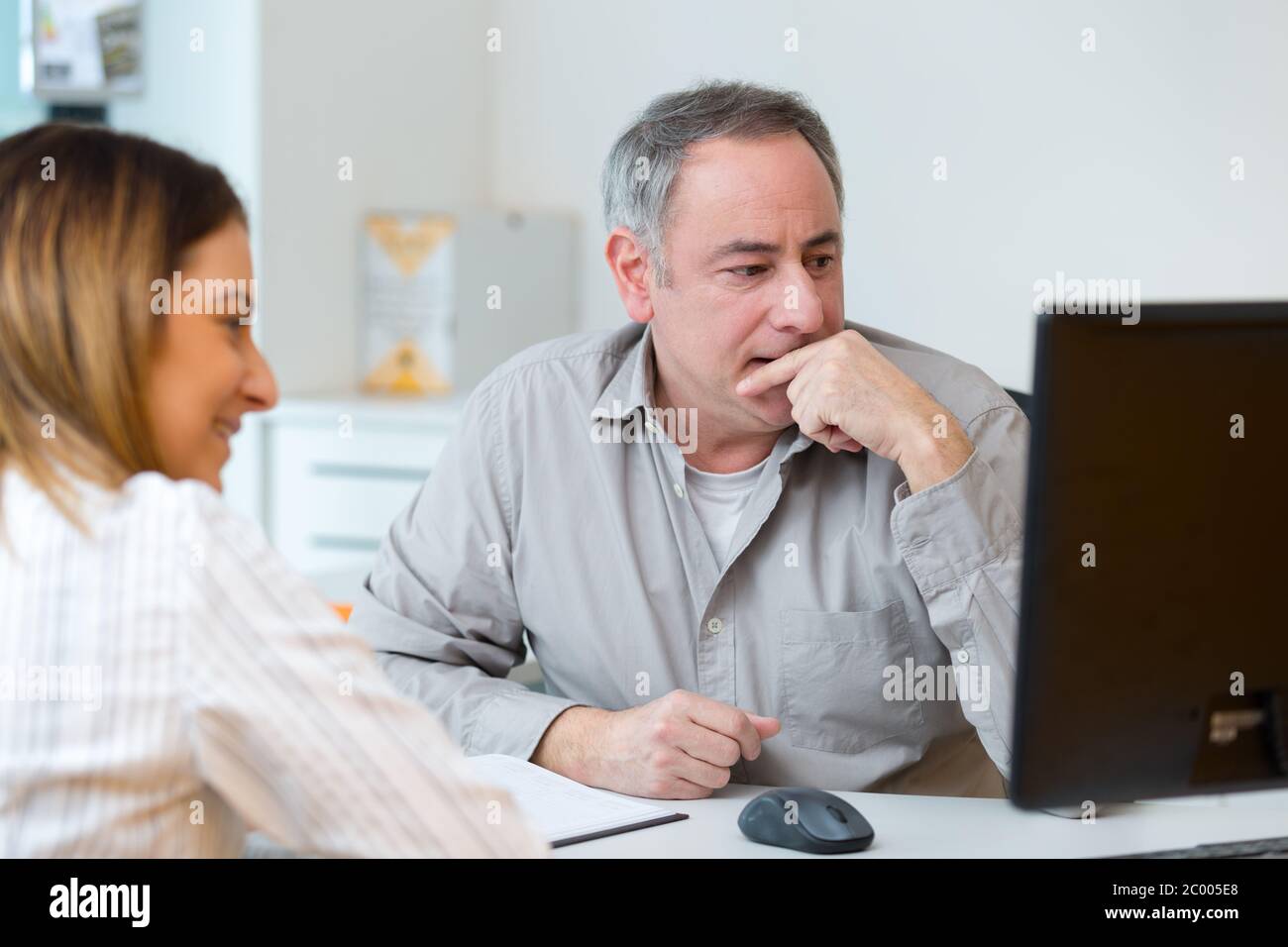 giving advice to a client Stock Photo - Alamy
