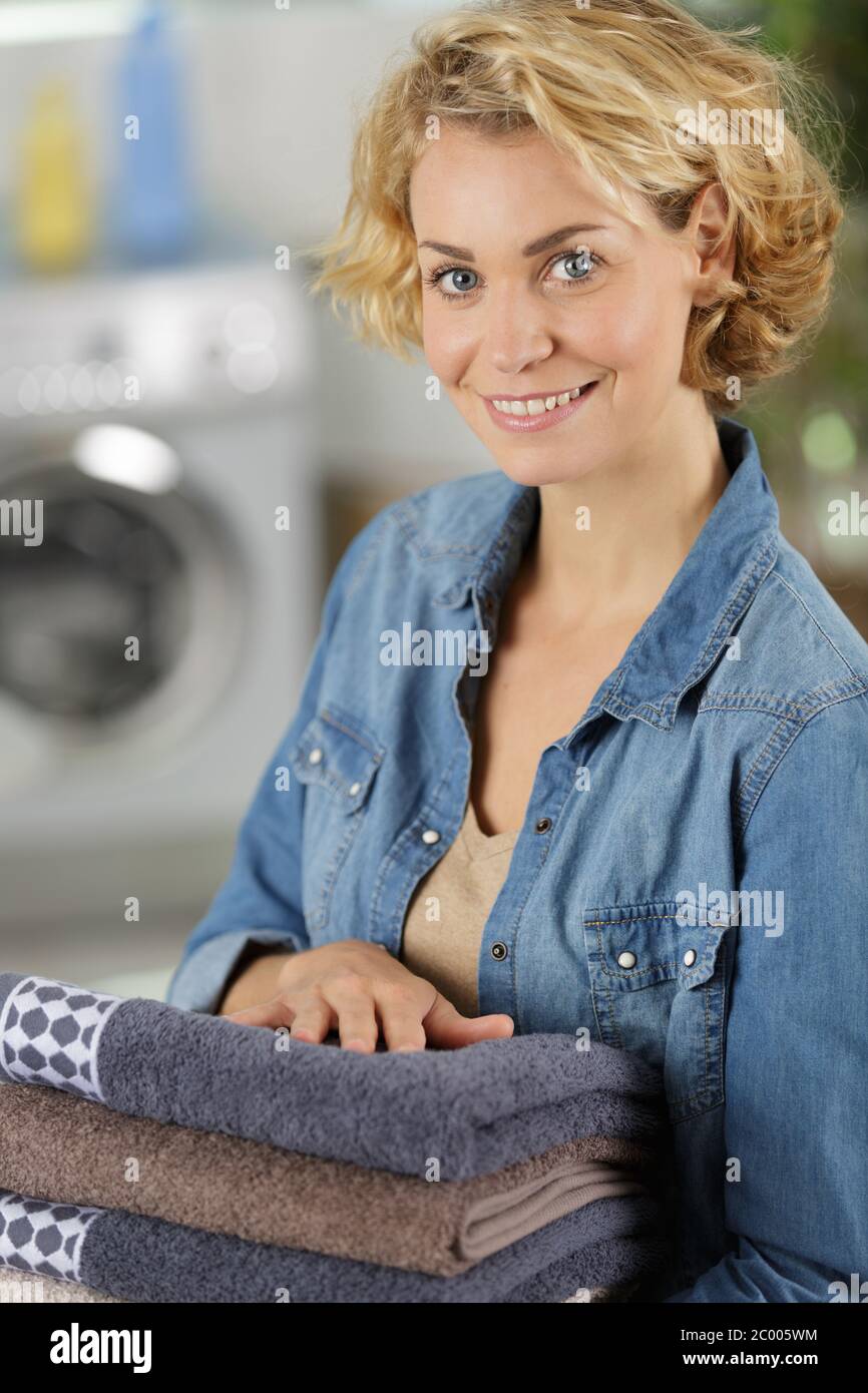 happy woman with fresh laundry Stock Photo - Alamy