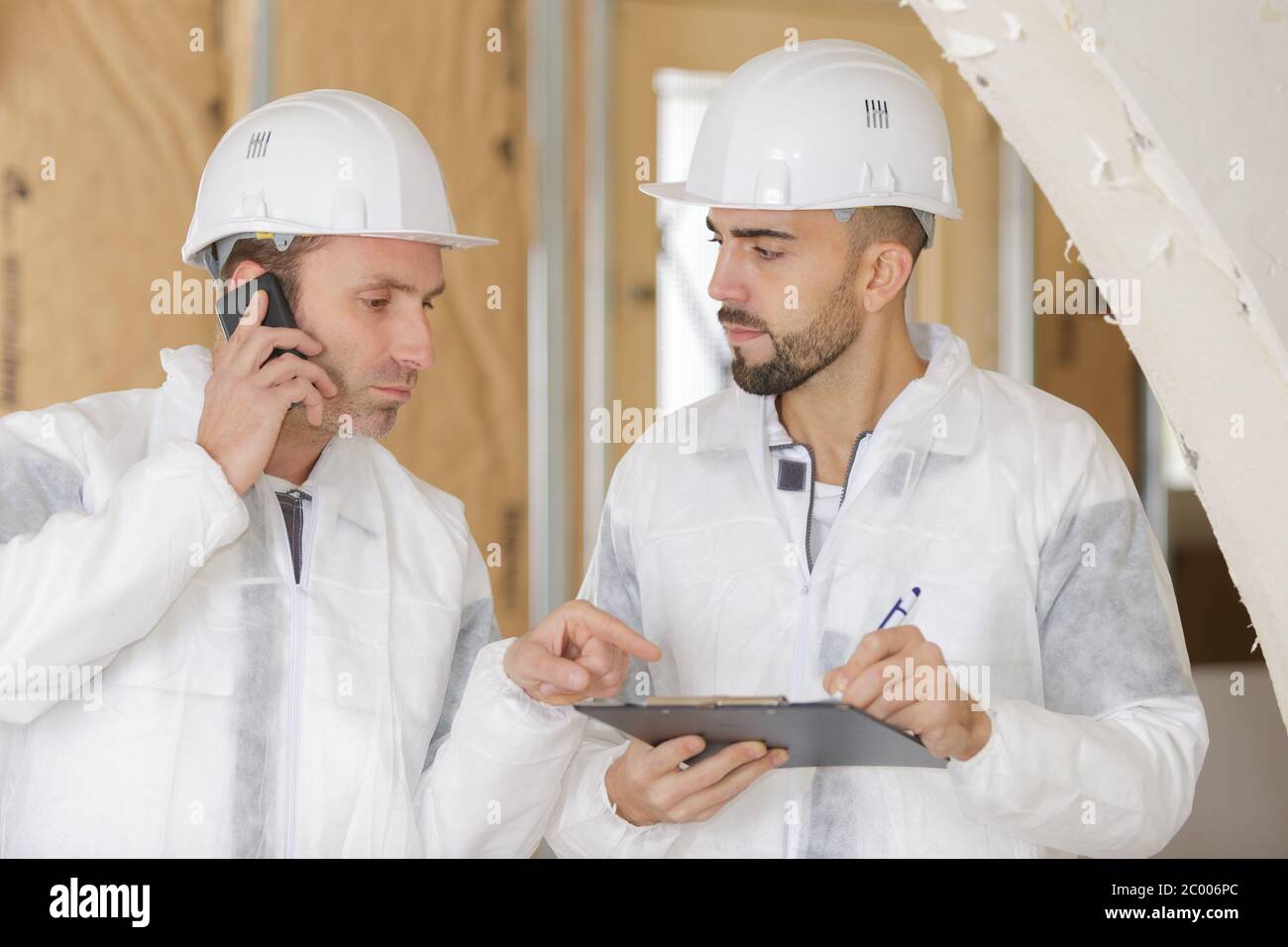 Construction contractor talking on cellphone hi-res stock photography ...