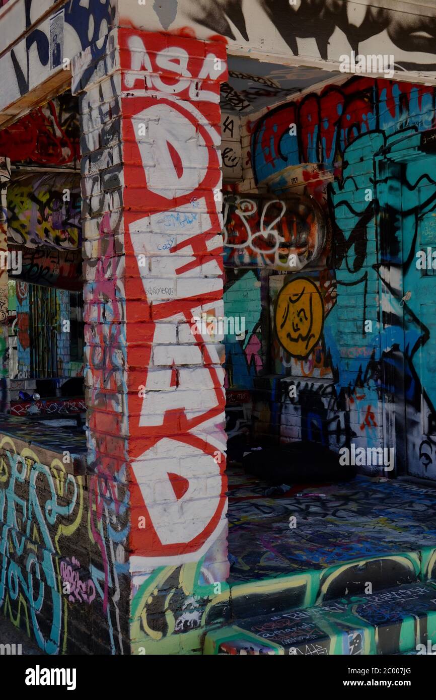 Colorful graffiti covers the outside of a house Stock Photo - Alamy