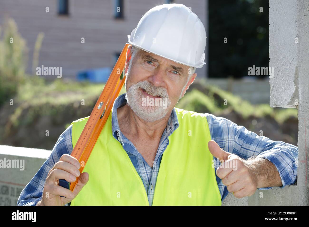 happy senior construction worker looking at camera Stock Photo - Alamy