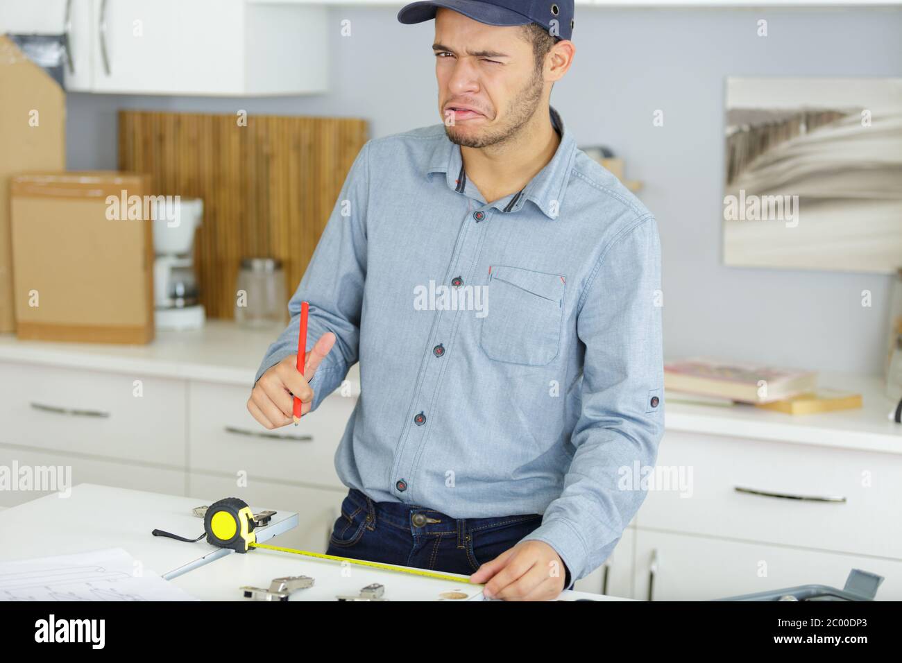 man took the wrong measurements Stock Photo - Alamy