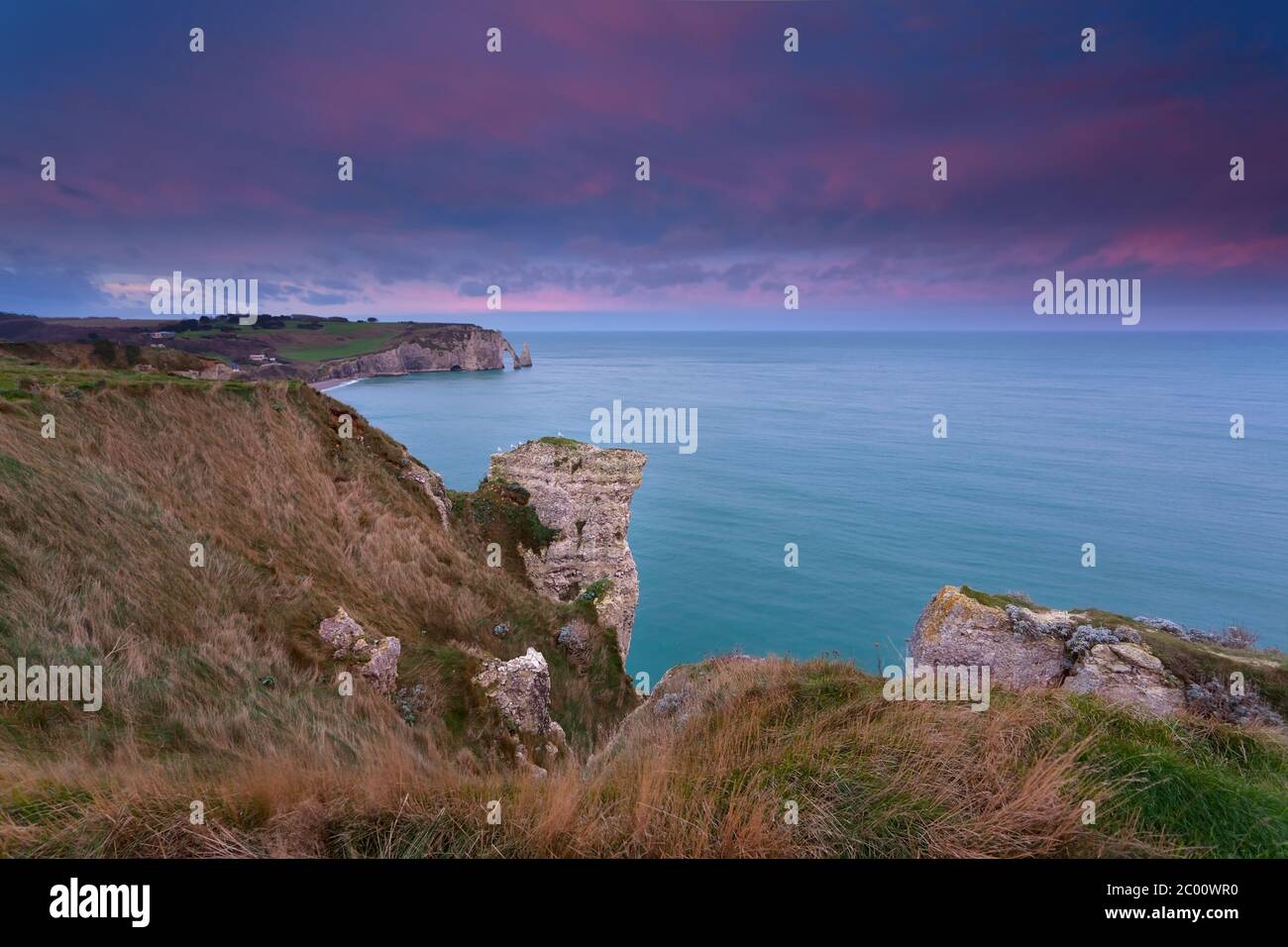 sunrise over rocks in Atlantic ocean Stock Photo - Alamy