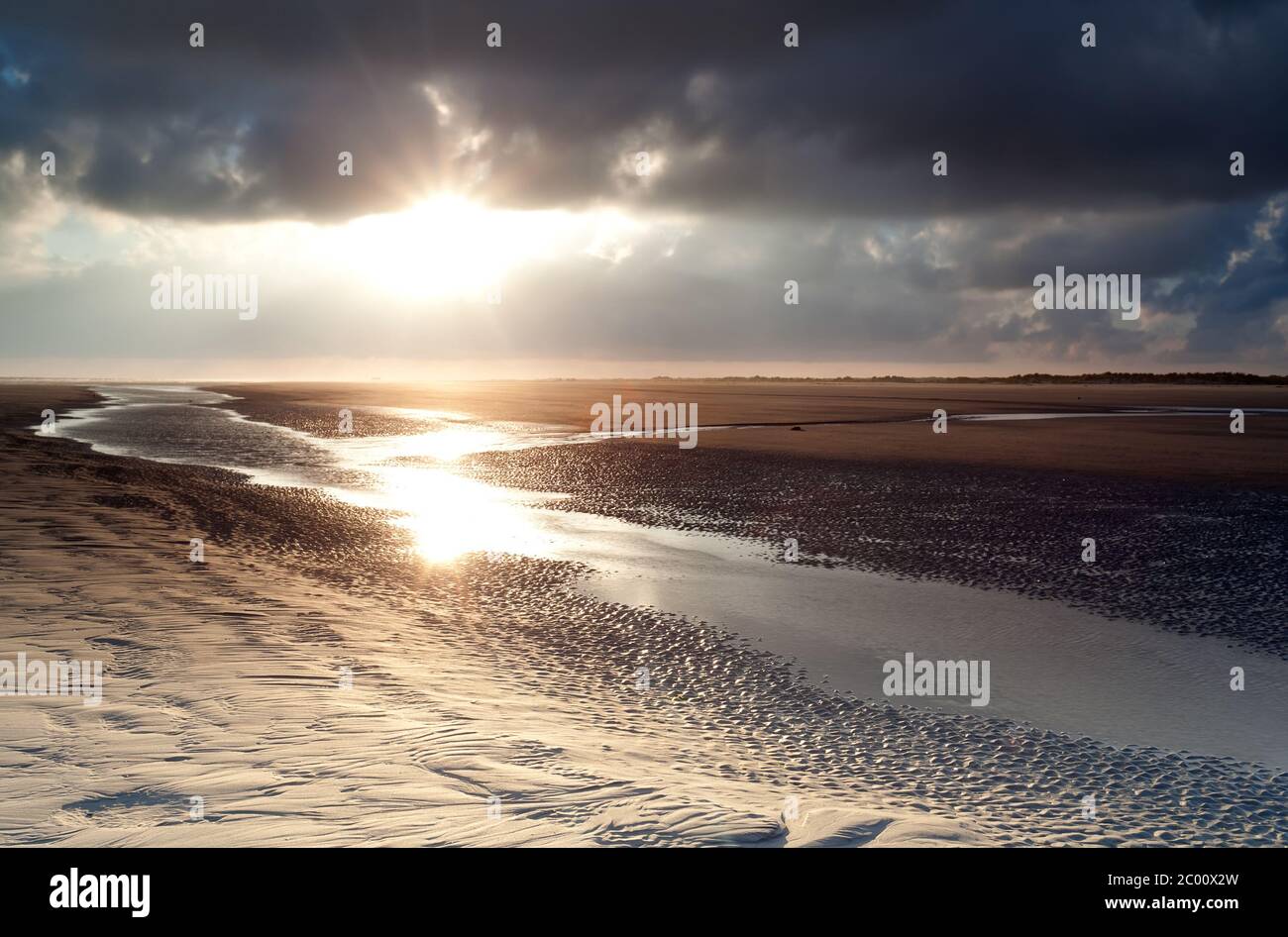 sunrise over sand beach on North sea Stock Photo - Alamy