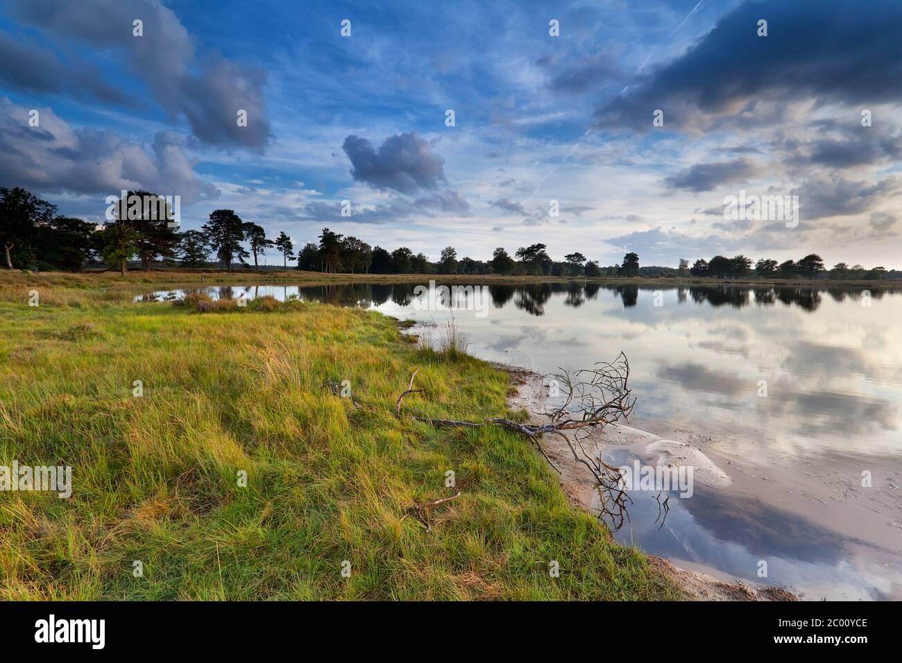 blue cloudscape reflected in lake Stock Photo - Alamy