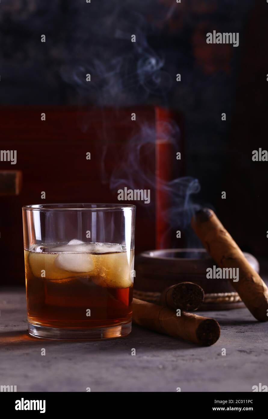 still life with cigars and alcohol men's history Stock Photo - Alamy