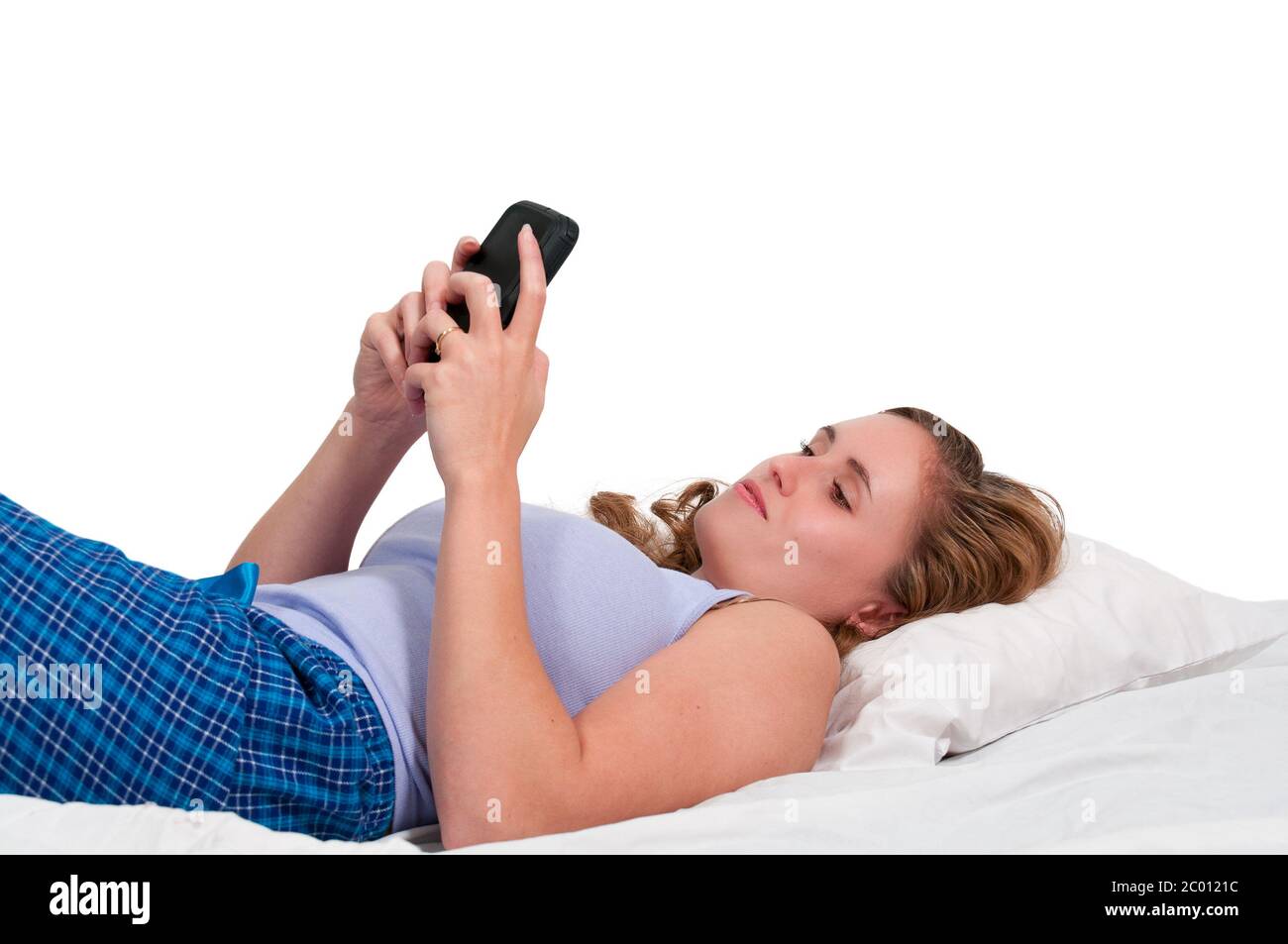 Woman reading text in bed hi-res stock photography and images - Alamy
