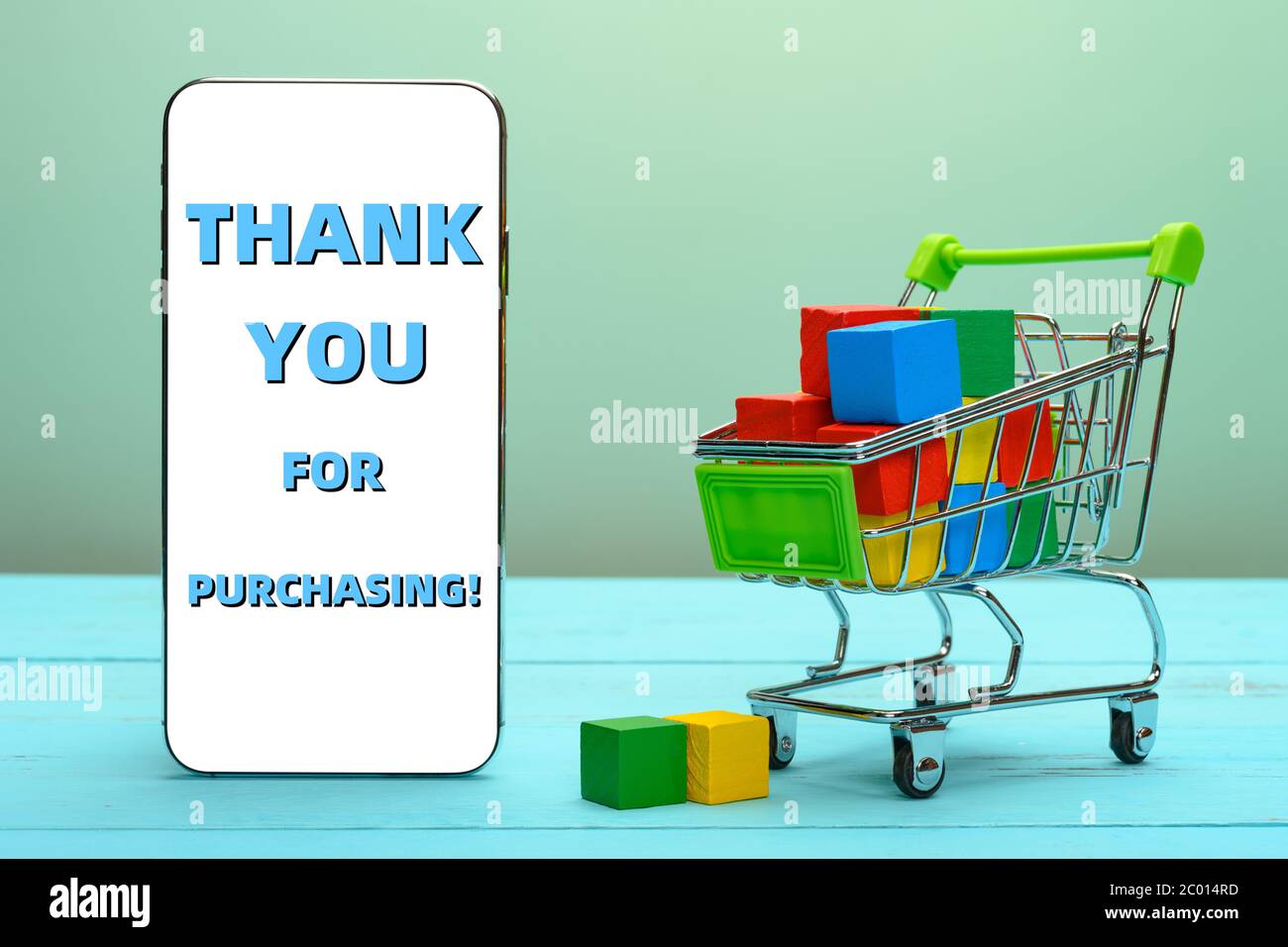 full filled shopping cart with a mobile showing THANK YOU FOR ...