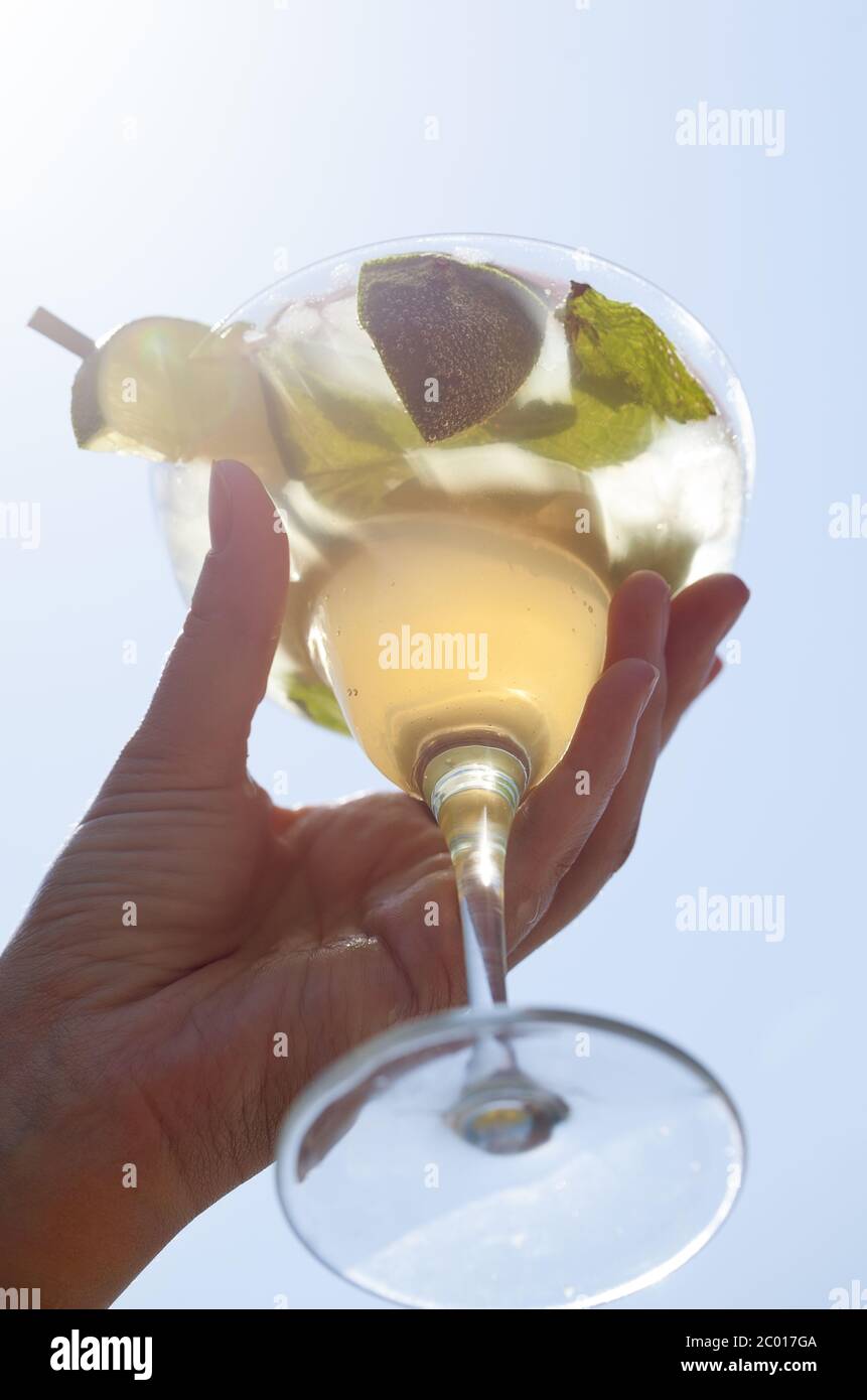 Hand holding cocktail hi-res stock photography and images - Alamy