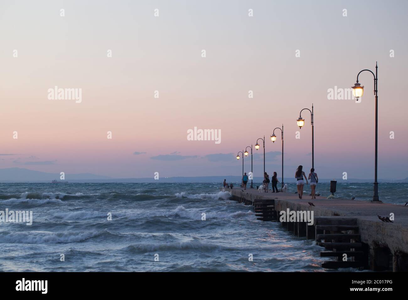 People walk along waterfront in hi-res stock photography and images - Alamy