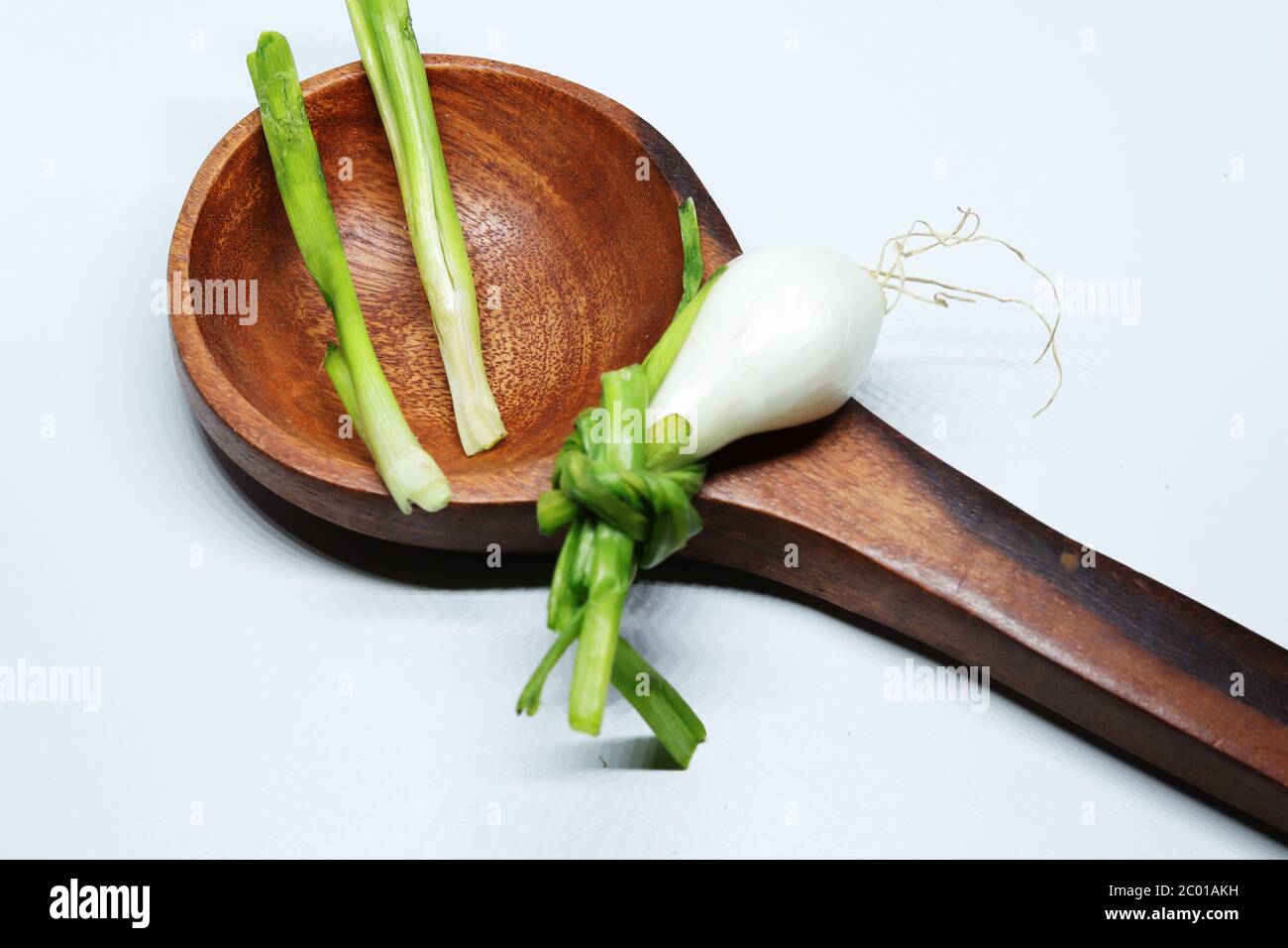 Fresh Green Spring Onion With Roots On An Isolated White Background ...