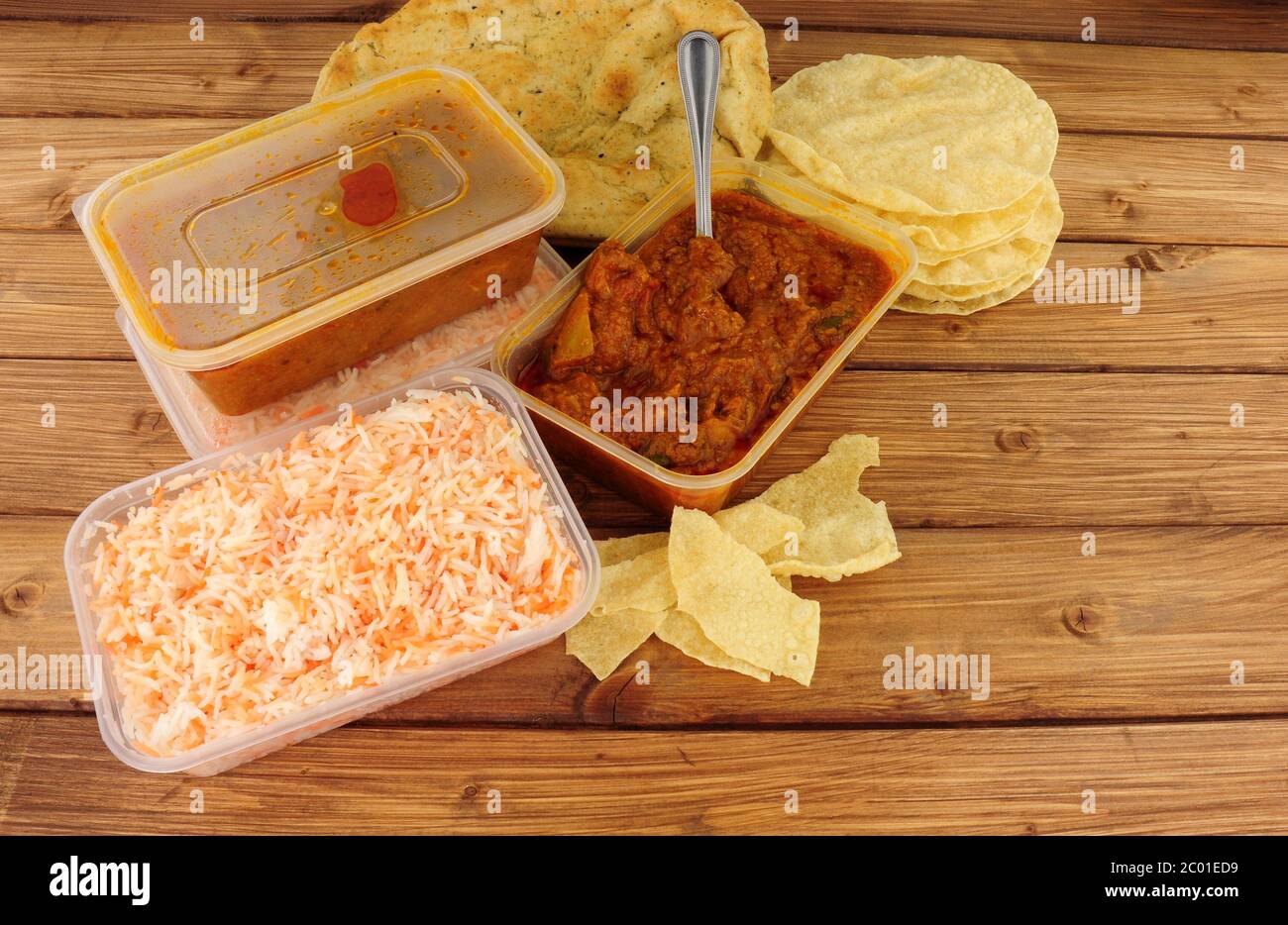 Indian curry take away meal with poppadoms and nan bread Stock Photo ...