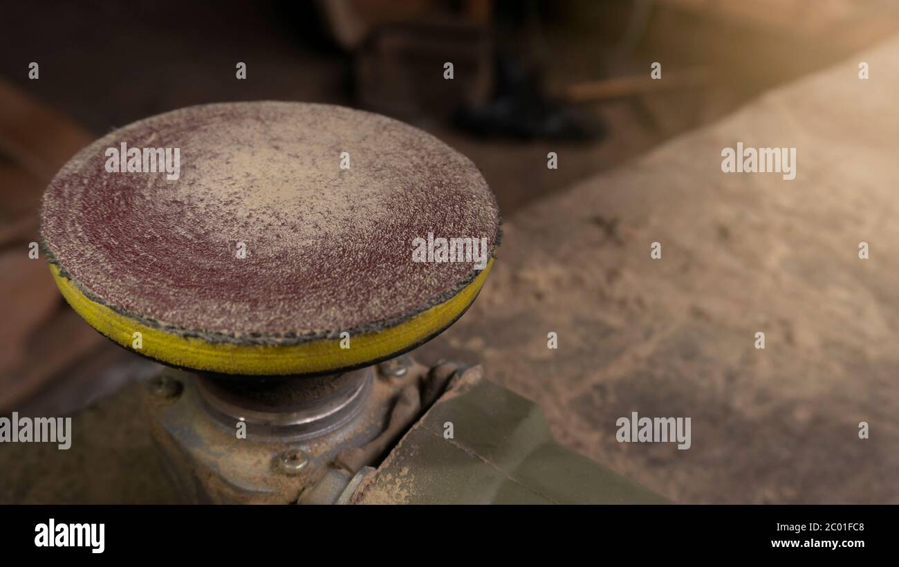 Sandpaper on a grinding machine, one of the methods of smoothing the ...