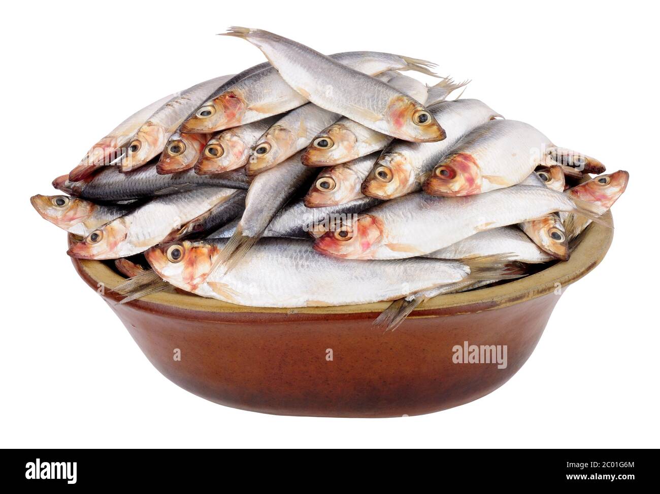 Rustic dish filled with fresh raw fish sprats isolated on a white ...