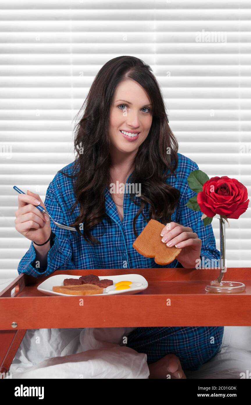 Woman Breakfast in Bed Stock Photo - Alamy