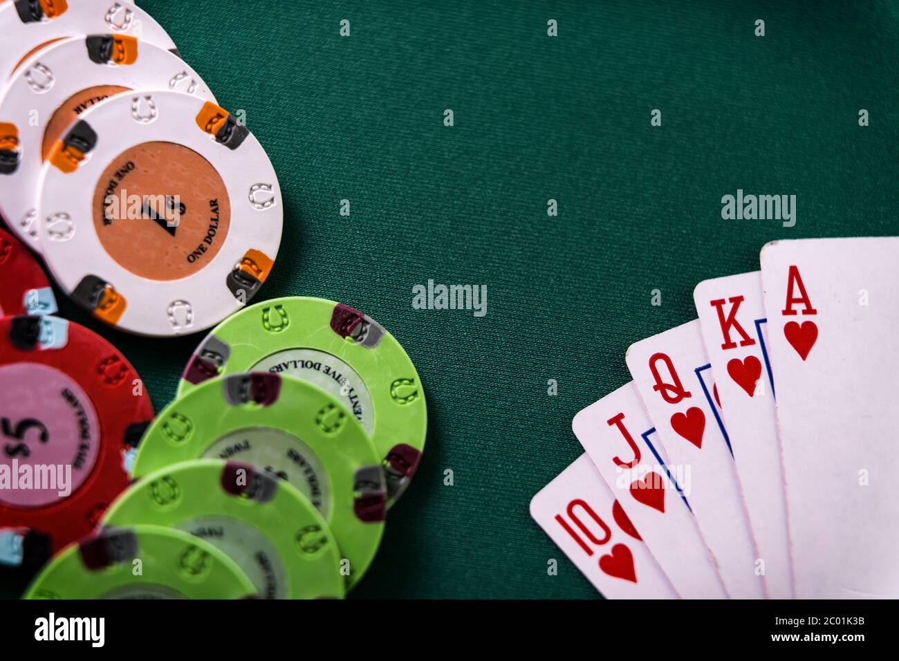 Poker game royal flush with chips Stock Photo - Alamy