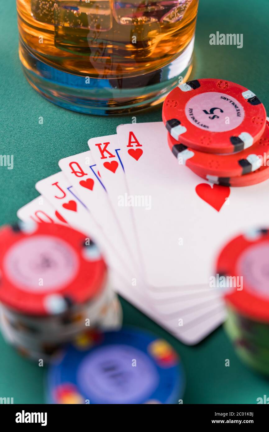 Poker game royal flush with chips Stock Photo - Alamy