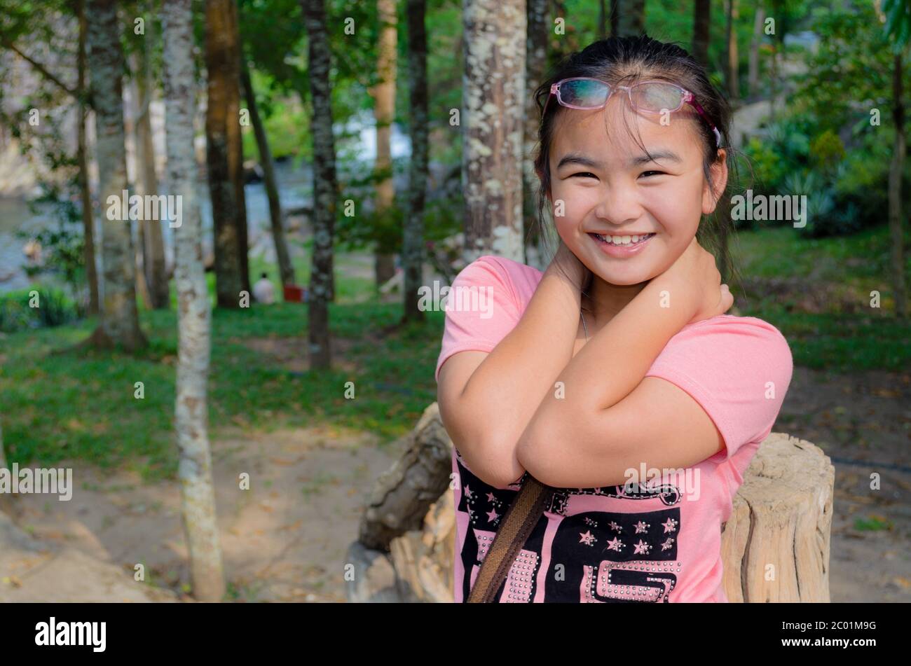 Young girl in the forest Stock Photo - Alamy