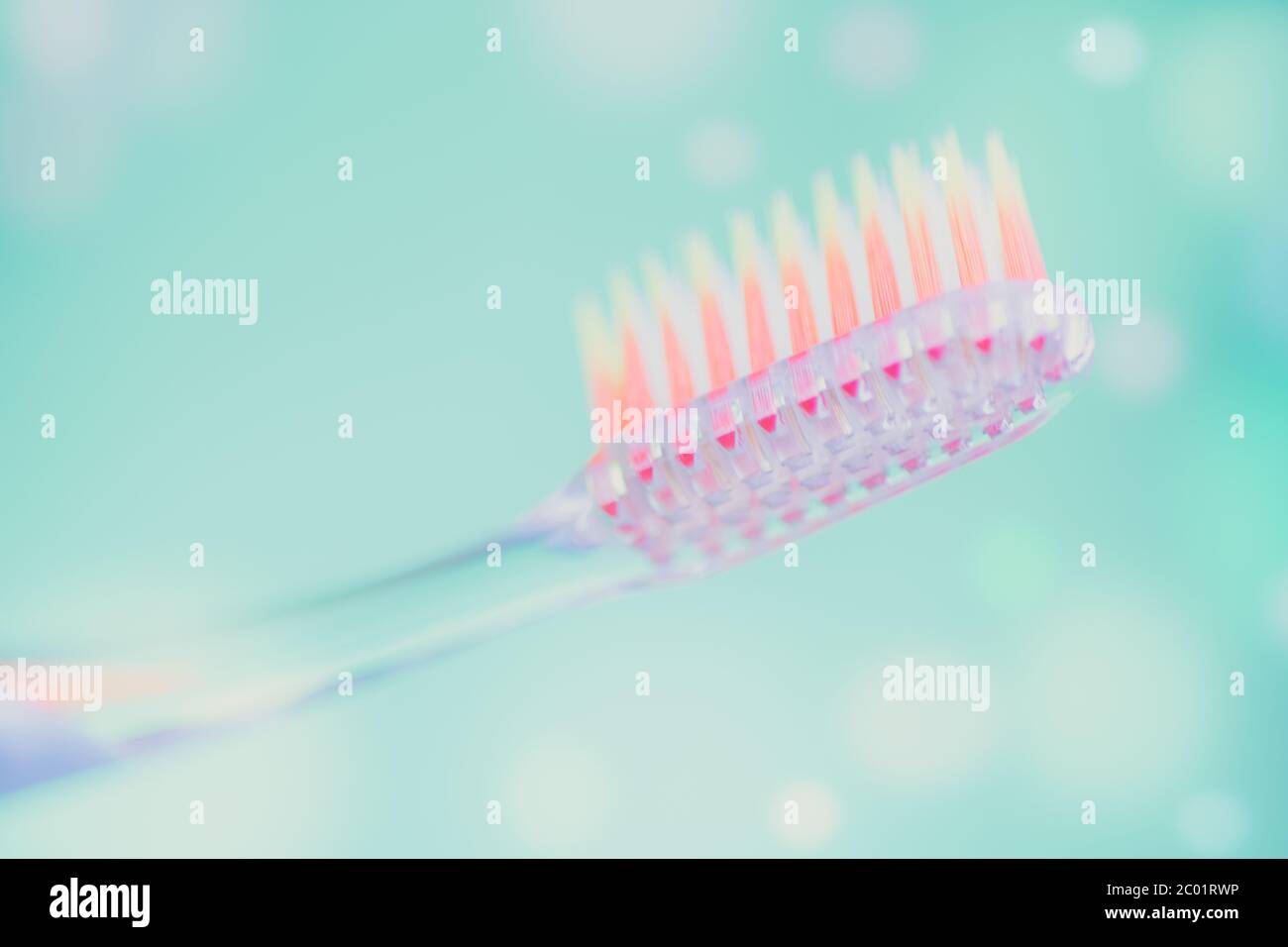 Plastic toothbrush on a green background with bubbles Stock Photo - Alamy
