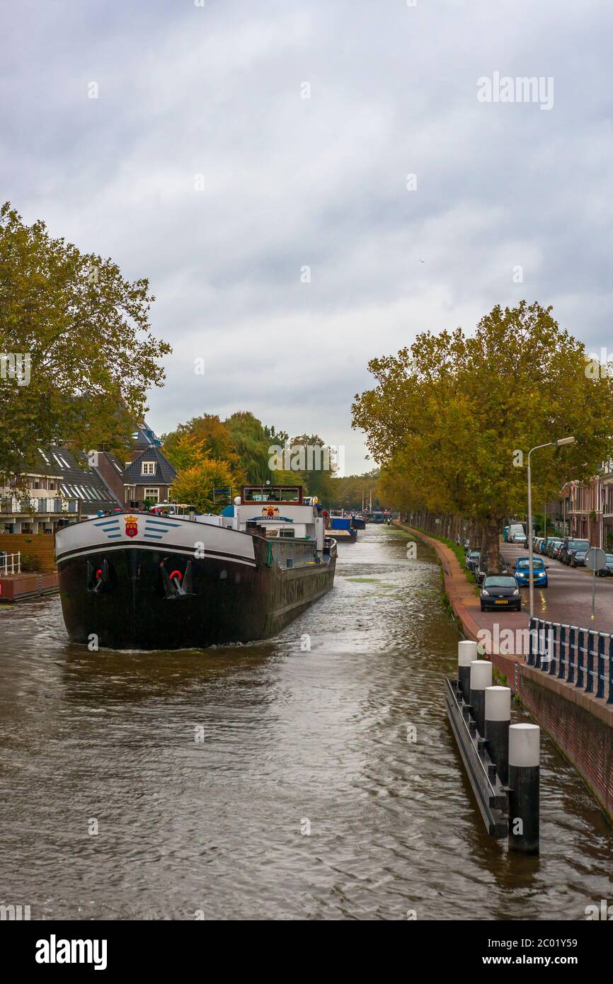 Barge navigating the Rijn-Schiekanaal, and approaching the Koepoort ...