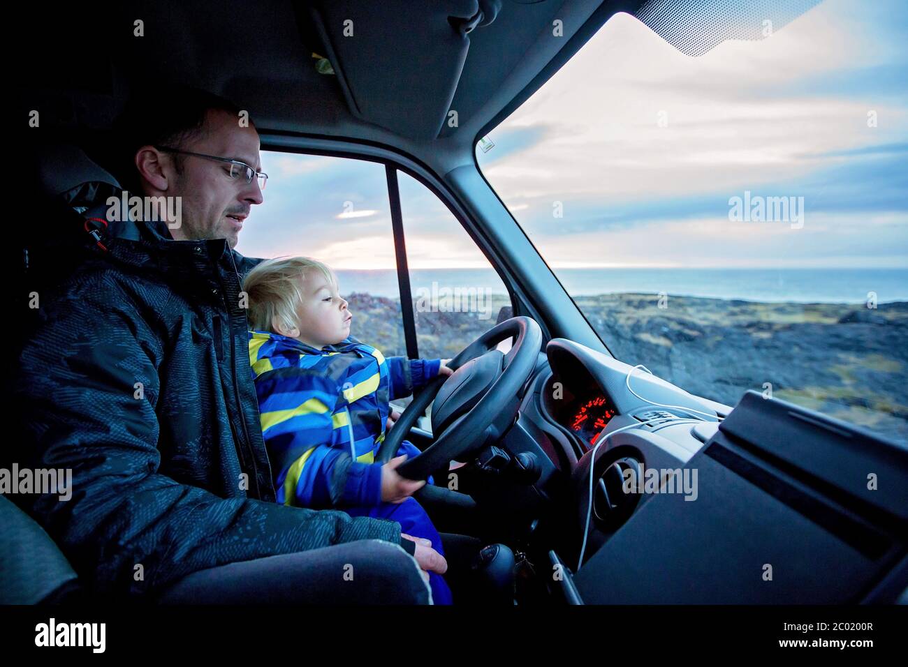 Cute toddler boy, kid driving big camper van, smiling happily Stock ...