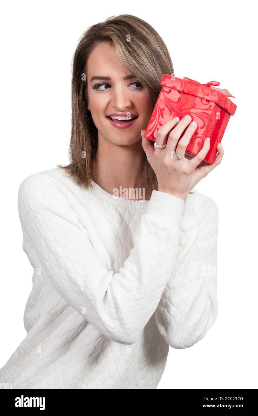 Beautiful Woman Shaking Gift Stock Photo - Alamy