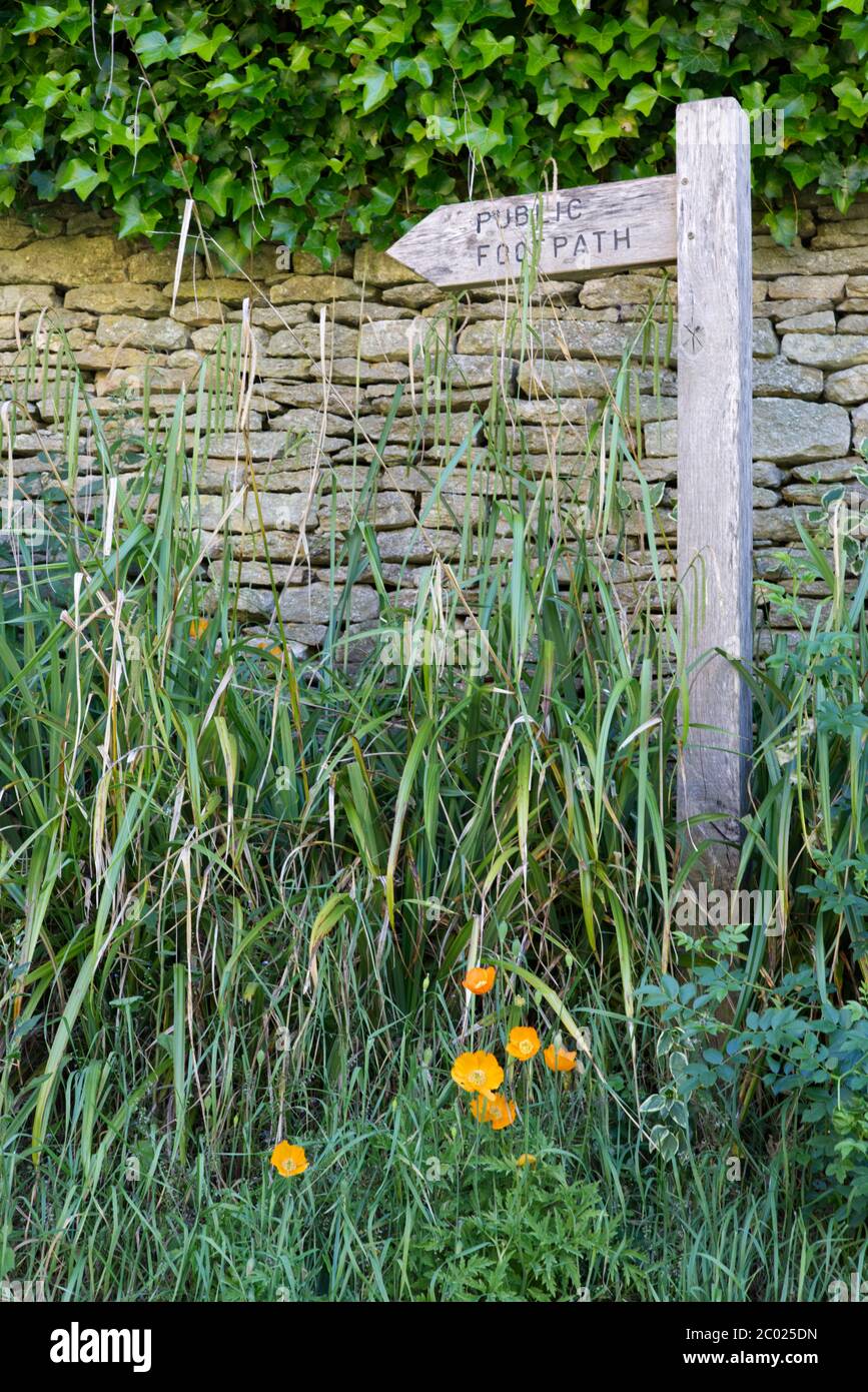 wooden public foot path sign in the countryside Stock Photo - Alamy